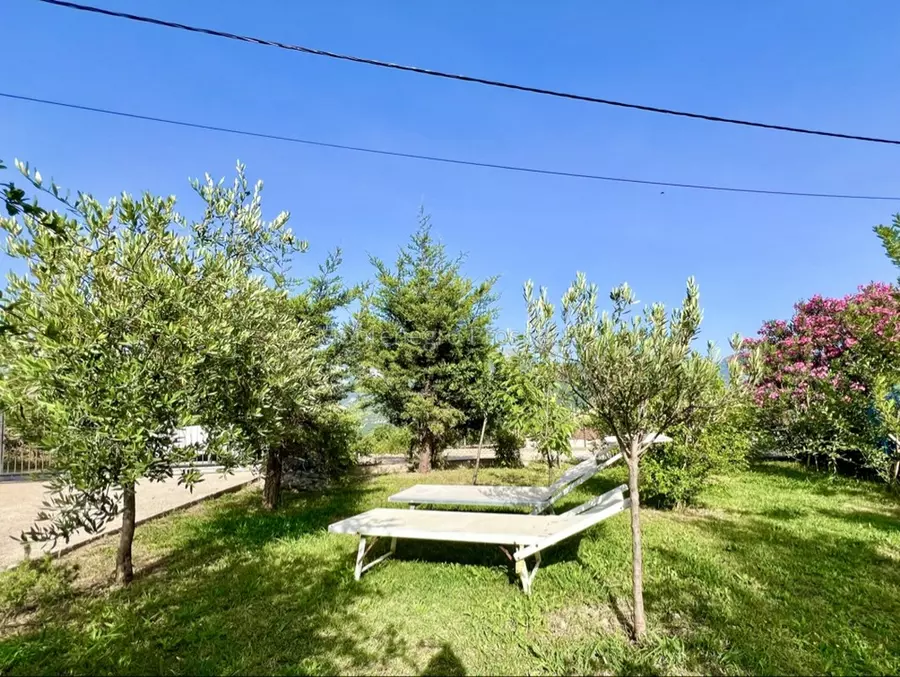 A house for sale with a garden and a beautiful view of the mountain in ...