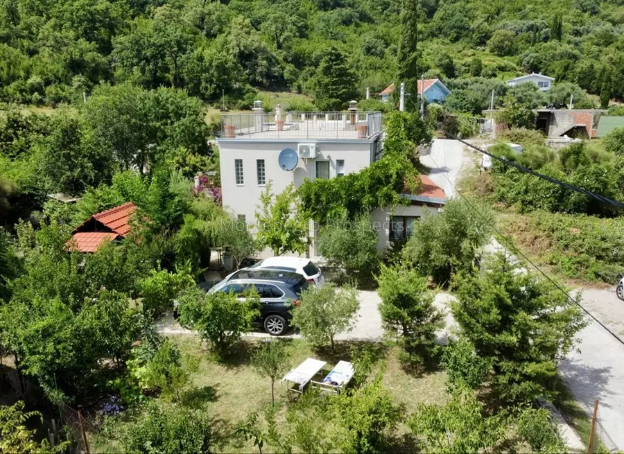 A house for sale with a garden and a beautiful view of the mountain in ...